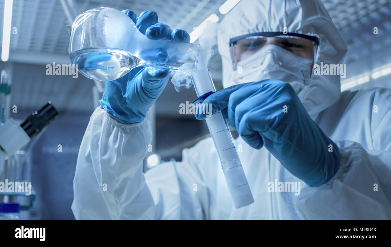 In a Secure High Level Research Laboratory Scientist Mixes Smoking ...