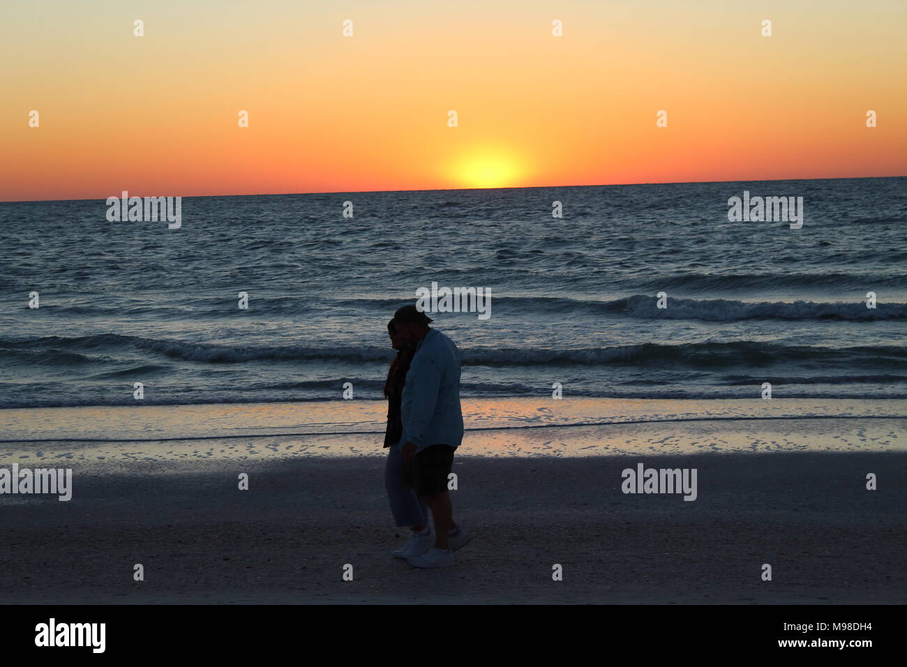 St. Pete Beach Couple Sunset Stock Photo - Alamy