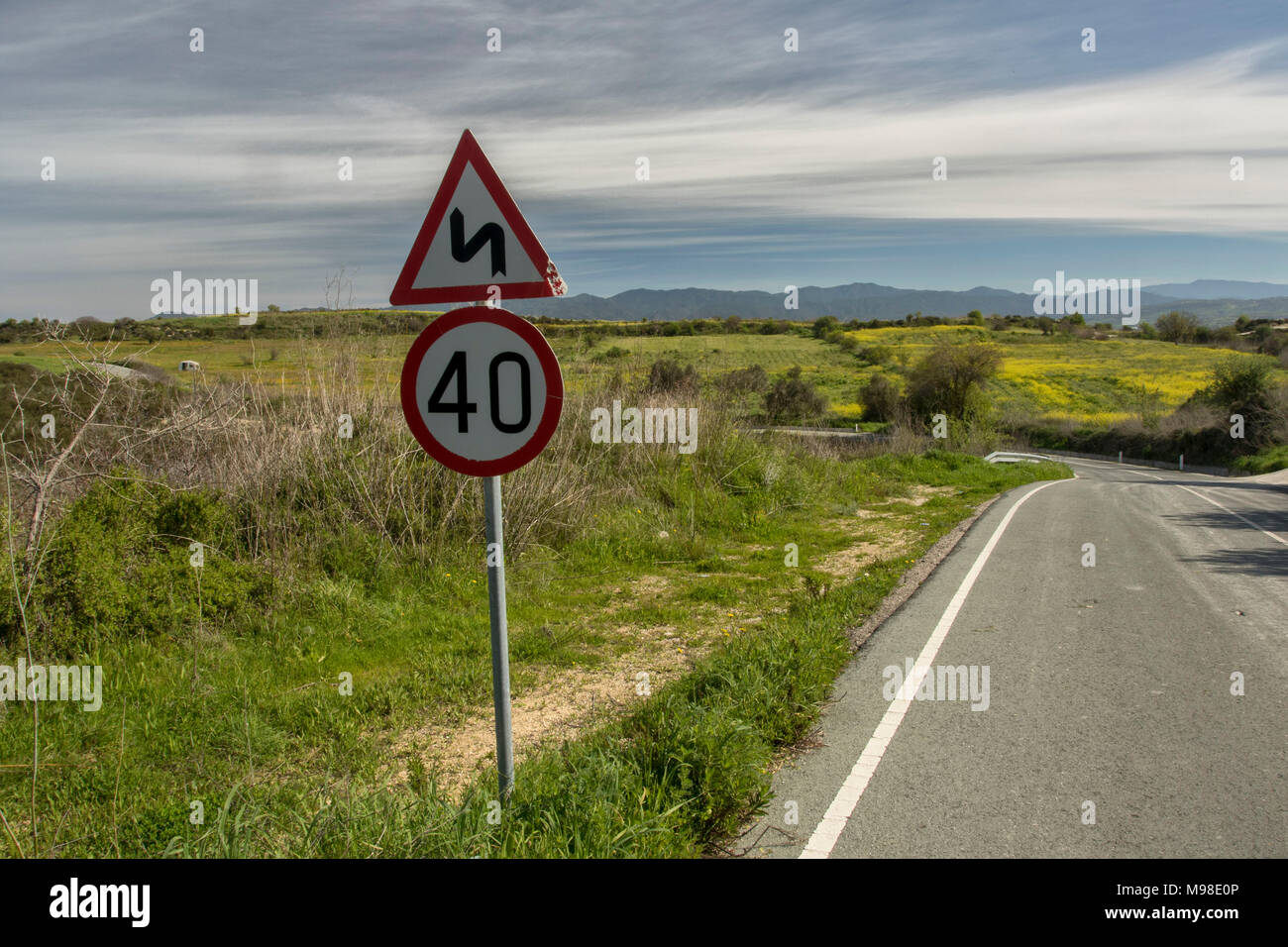 Tourist road in Paphos district showing speed limit and winding road in ...