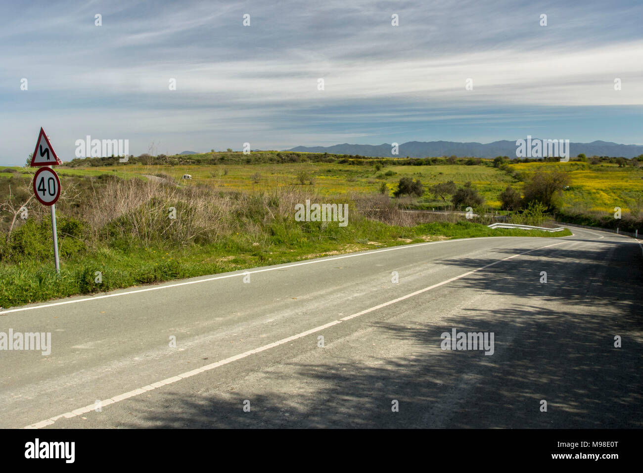 Tourist road in Paphos district showing speed limit and winding road in ...