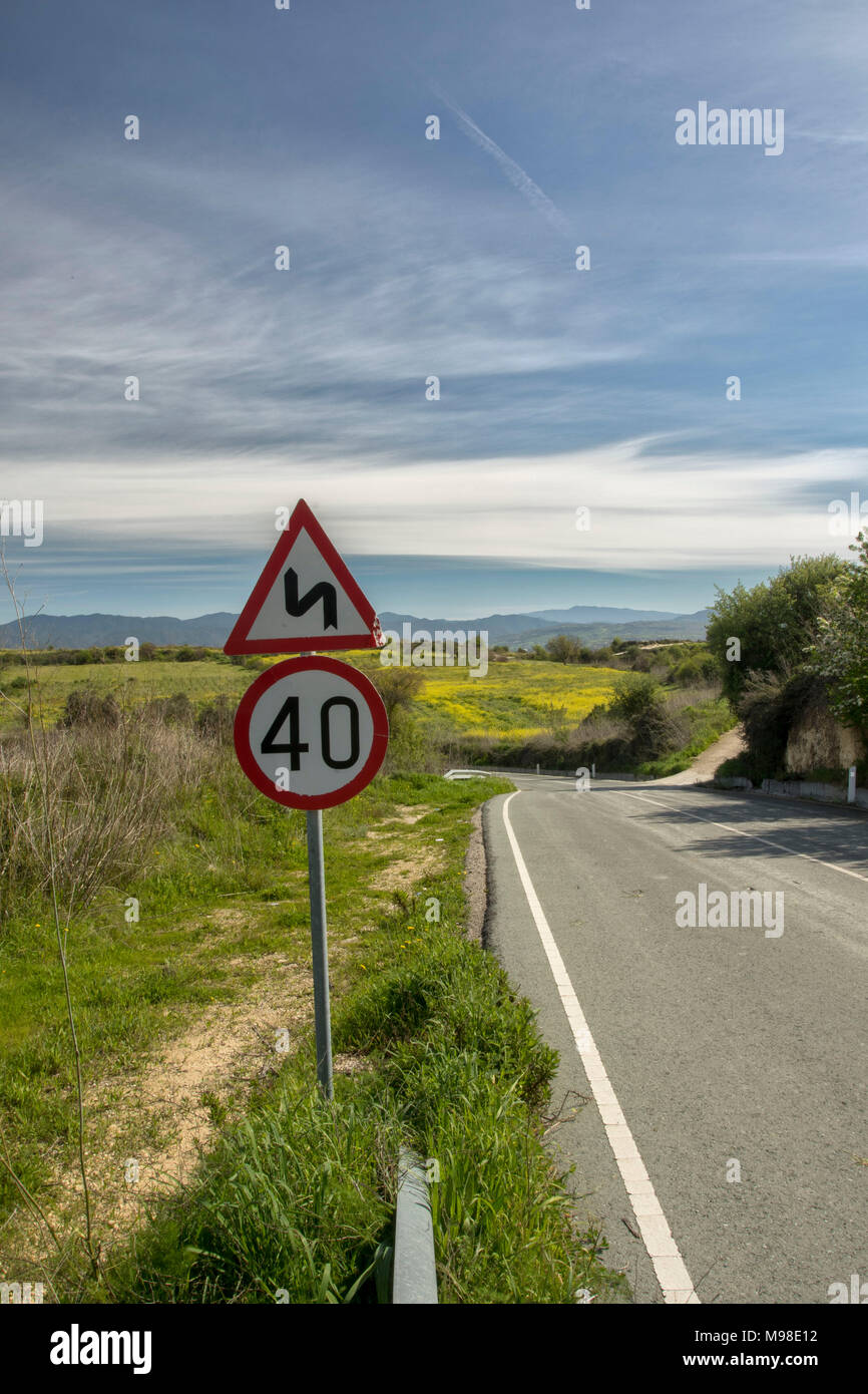 Tourist road in Paphos district showing speed limit and winding road in ...