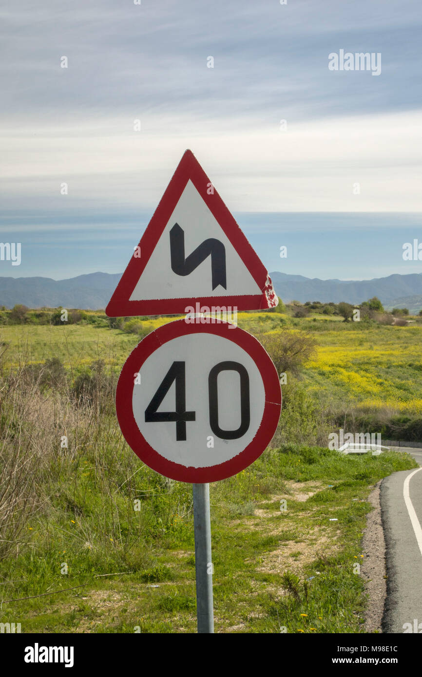 Tourist road in Paphos district showing speed limit and winding road in ...
