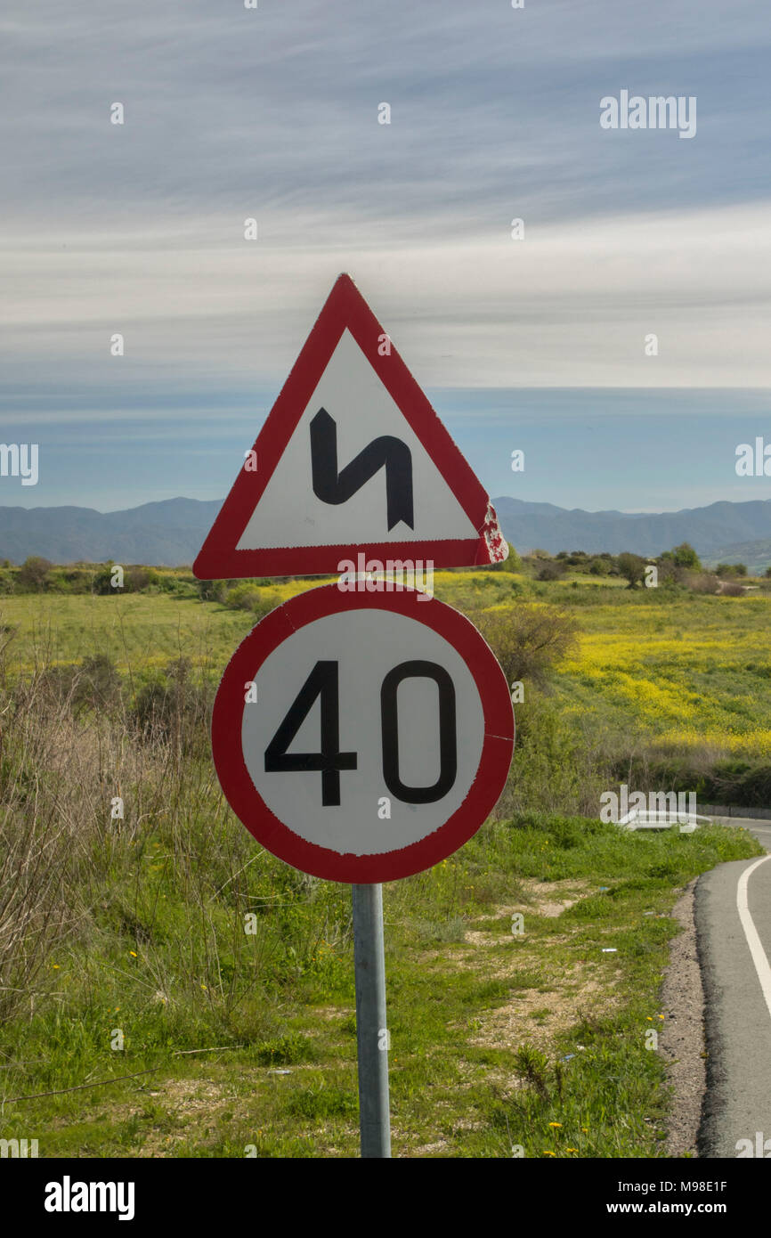Tourist road in Paphos district showing speed limit and winding road in ...