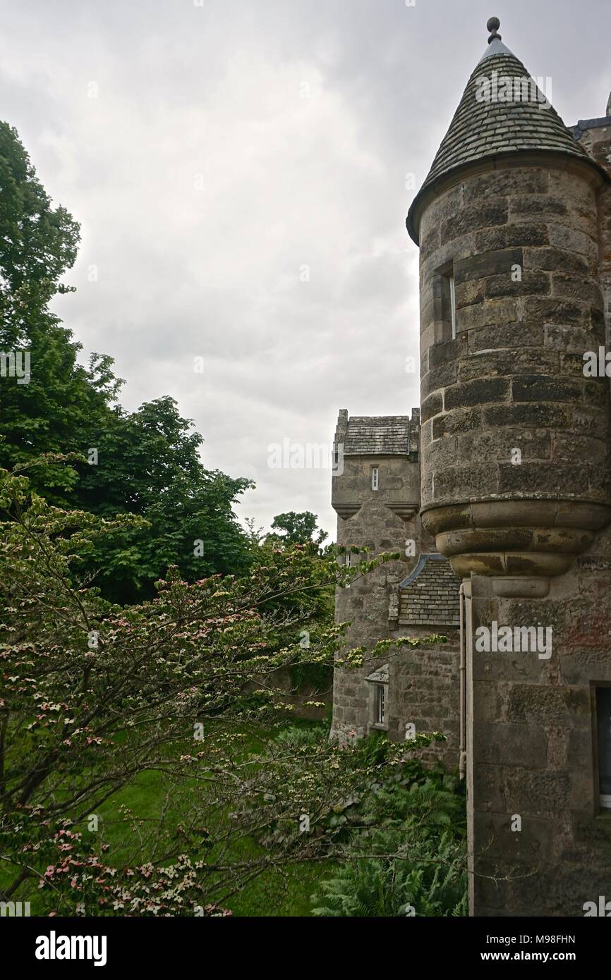 Cawdor Castle in the Highlands of Scotland. The castle is built around ...