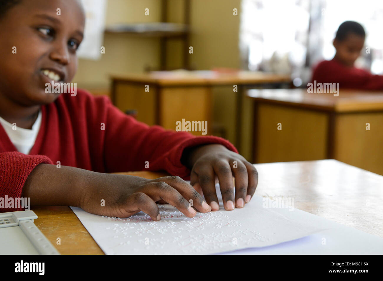 ETHIOPIA, Amhara, Gondar, school for blind children, reading braille ...