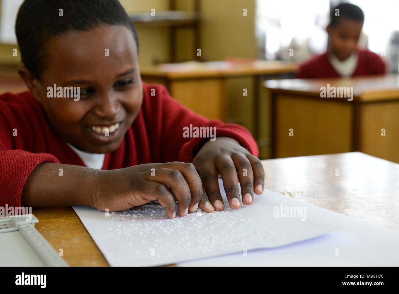 ETHIOPIA, Amhara, Gondar, school for blind children, reading braille ...