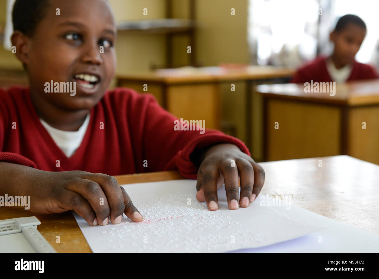 ETHIOPIA, Amhara, Gondar, school for blind children, reading braille ...