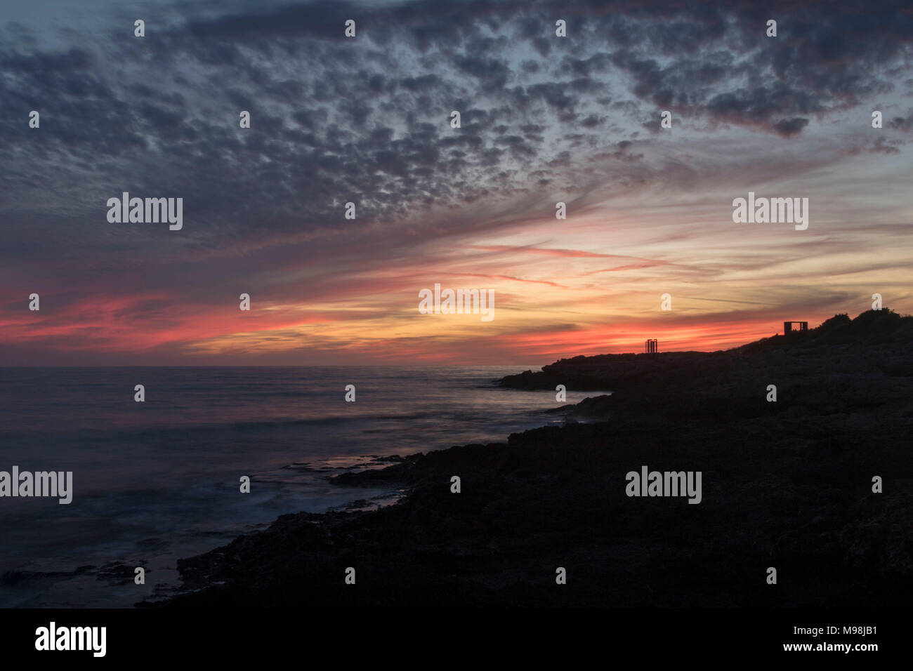 Dramatic sunset sky over the mediterranean sea from the tourist resort ...