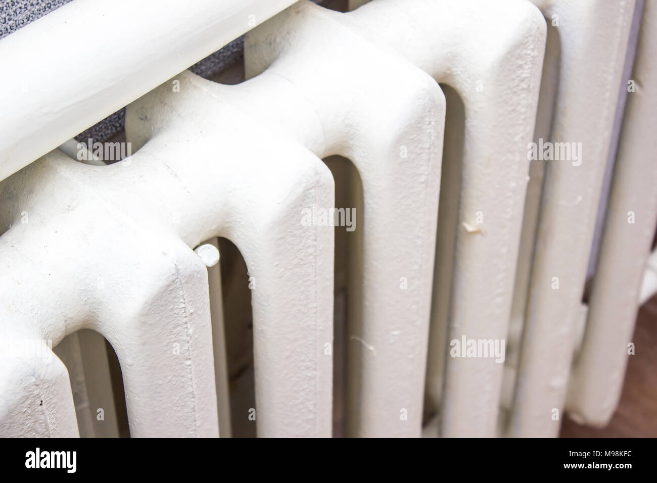 White cast-iron radiator closeup Stock Photo - Alamy