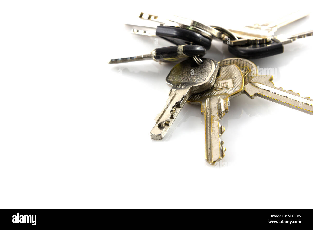 Large bunch of keys isolate on white background Stock Photo - Alamy