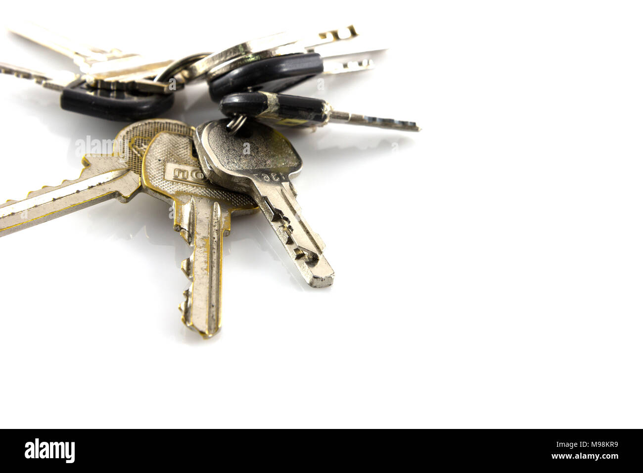 Large bunch of keys isolate on white background Stock Photo - Alamy