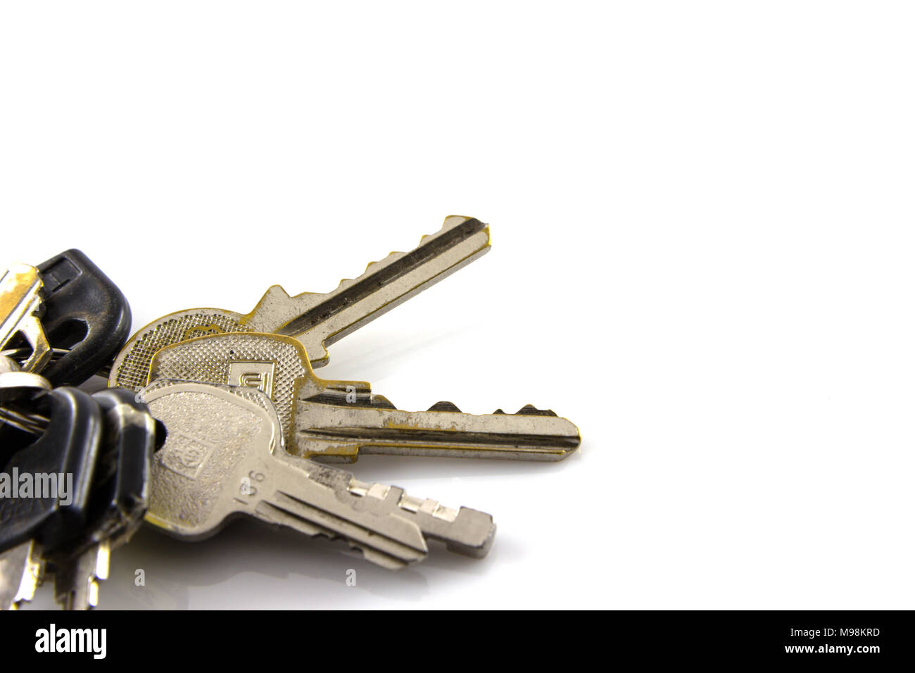Large bunch of keys isolate on white background Stock Photo - Alamy