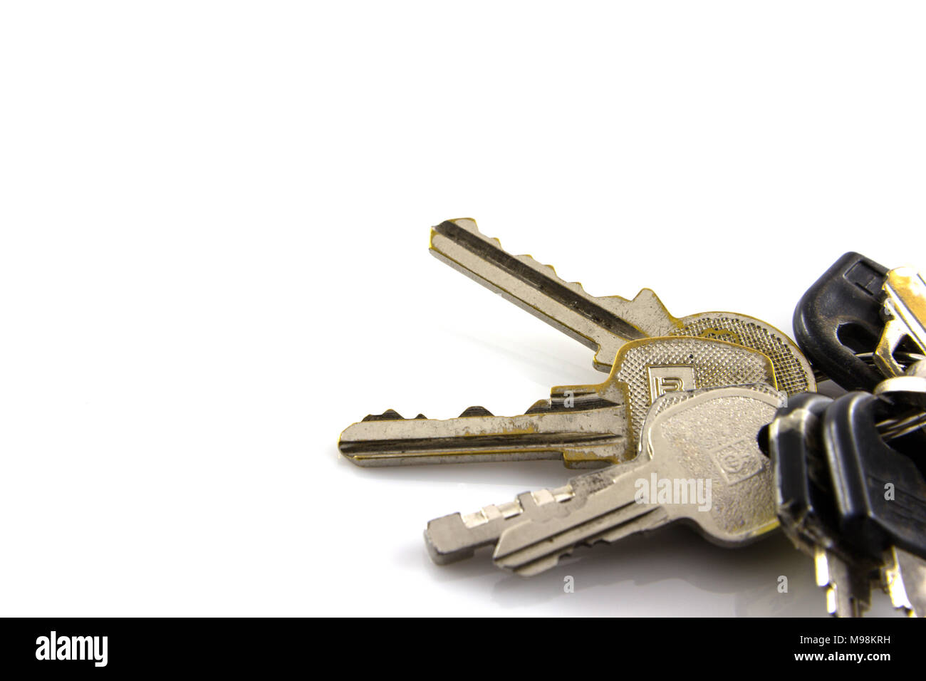Large bunch of keys isolate on white background Stock Photo - Alamy