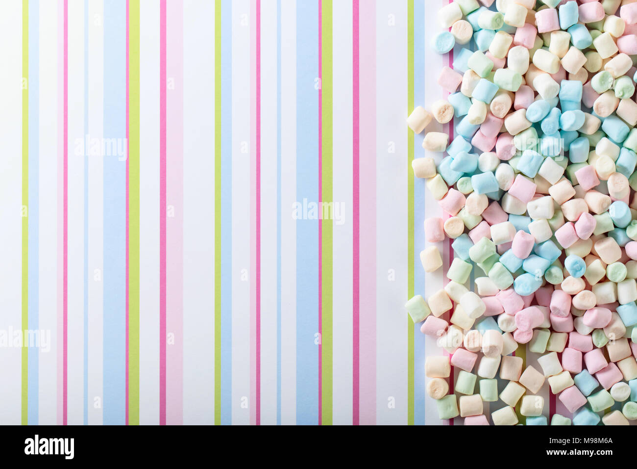 Marshmallows on a striped background . Background or texture of ...