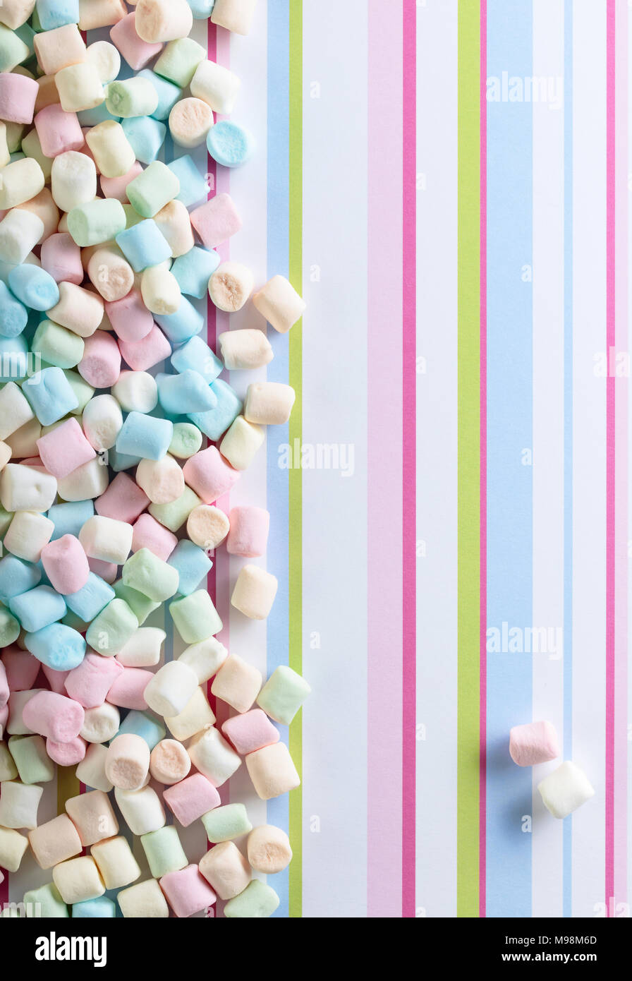 Marshmallows on a striped background . Background or texture of ...