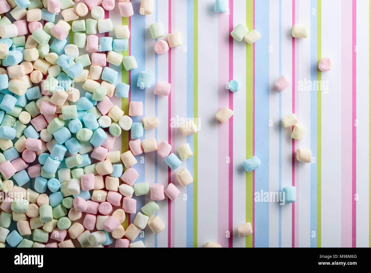 Marshmallows on a striped background . Background or texture of ...