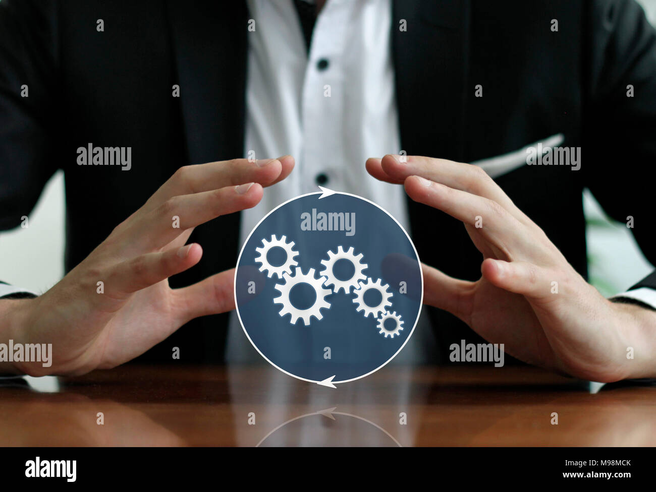 Integrated processes - hands protecting process chain Stock Photo - Alamy