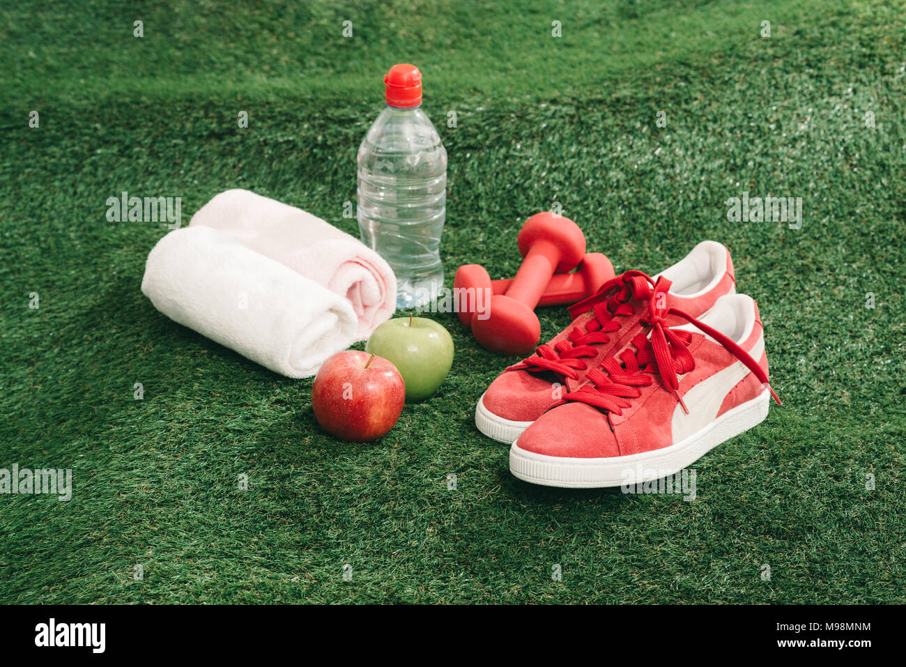 fitness concept with Exercise Equipment on green grass background Stock ...