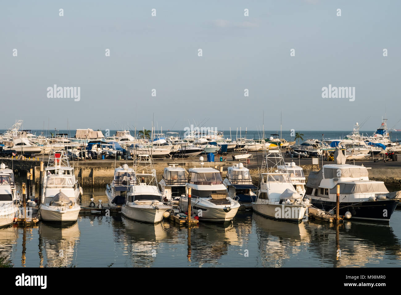 Yacht boat harbor - motor boats docked at port Stock Photo - Alamy