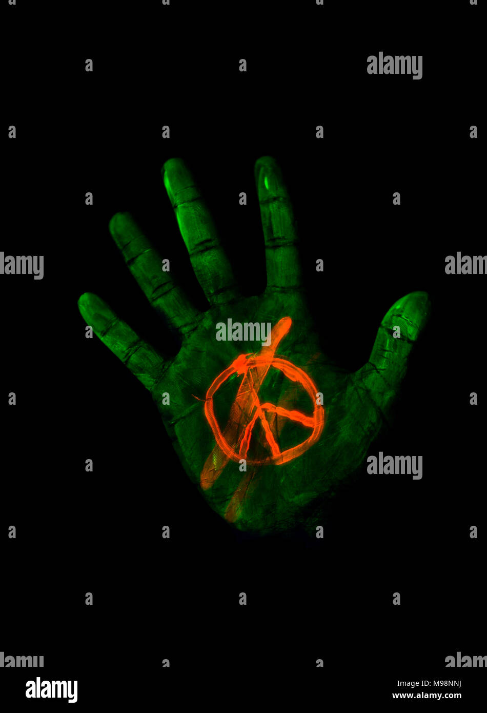 The hand was painted with glowing colors and a peace symbol Stock Photo ...