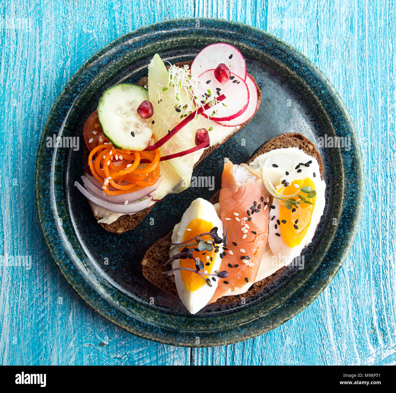 Healthy breakfast toasts. Wholegrain rye bread slices with cream cheese ...