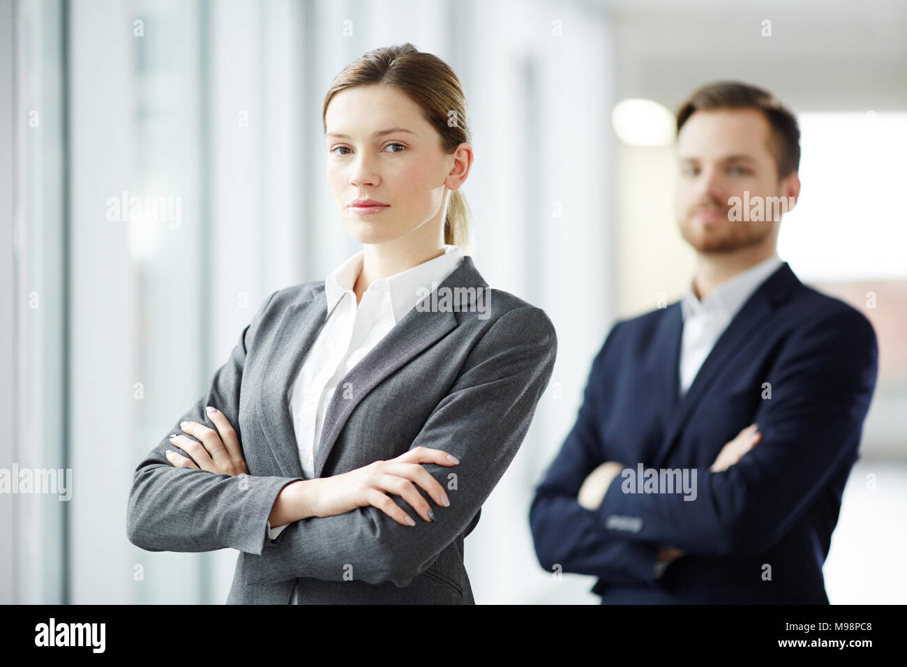 Young serious female employee hi-res stock photography and images - Alamy