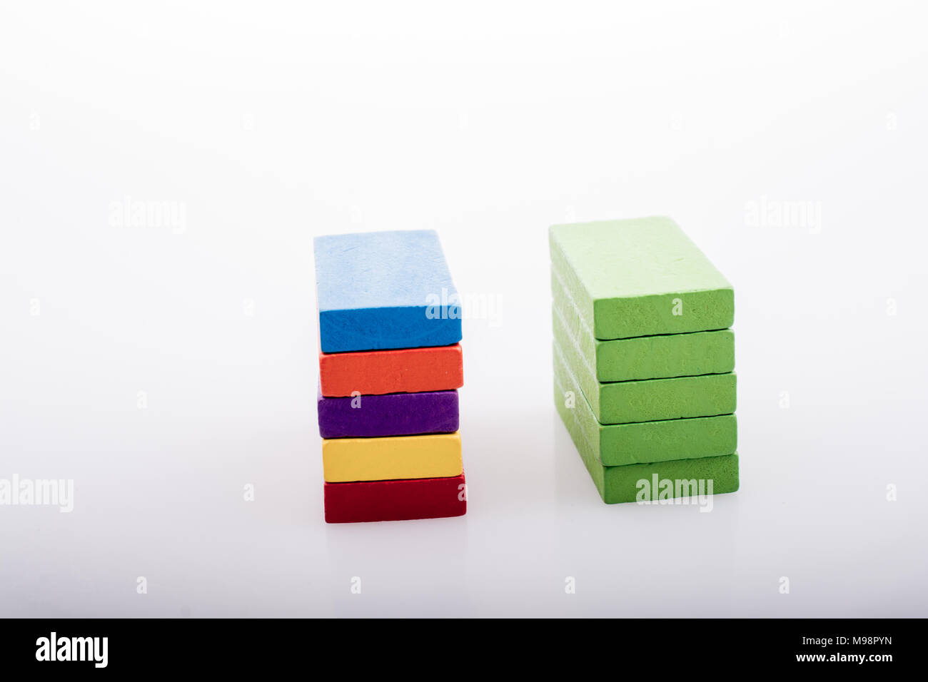 Colorful Domino Blocks in a line on a white background Stock Photo - Alamy