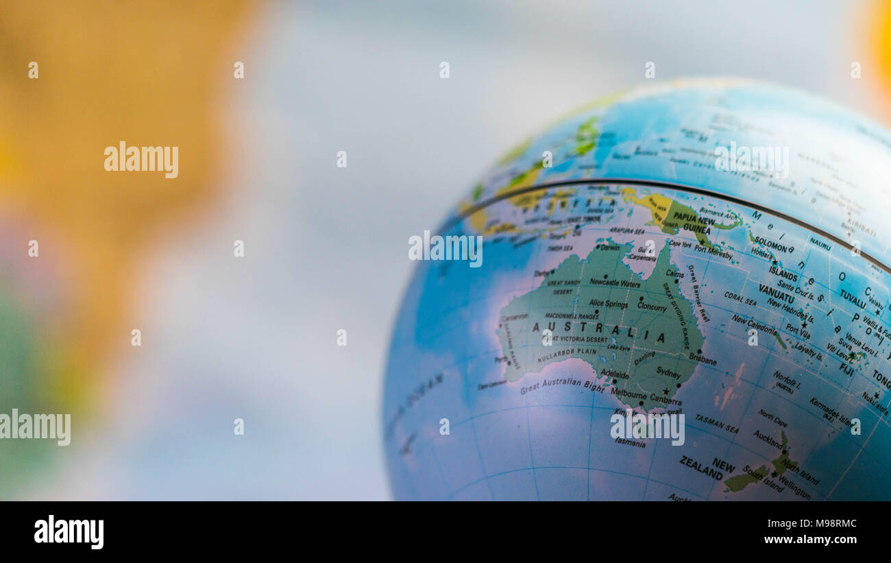 Australia map on a globe with earth map in the background Stock Photo ...