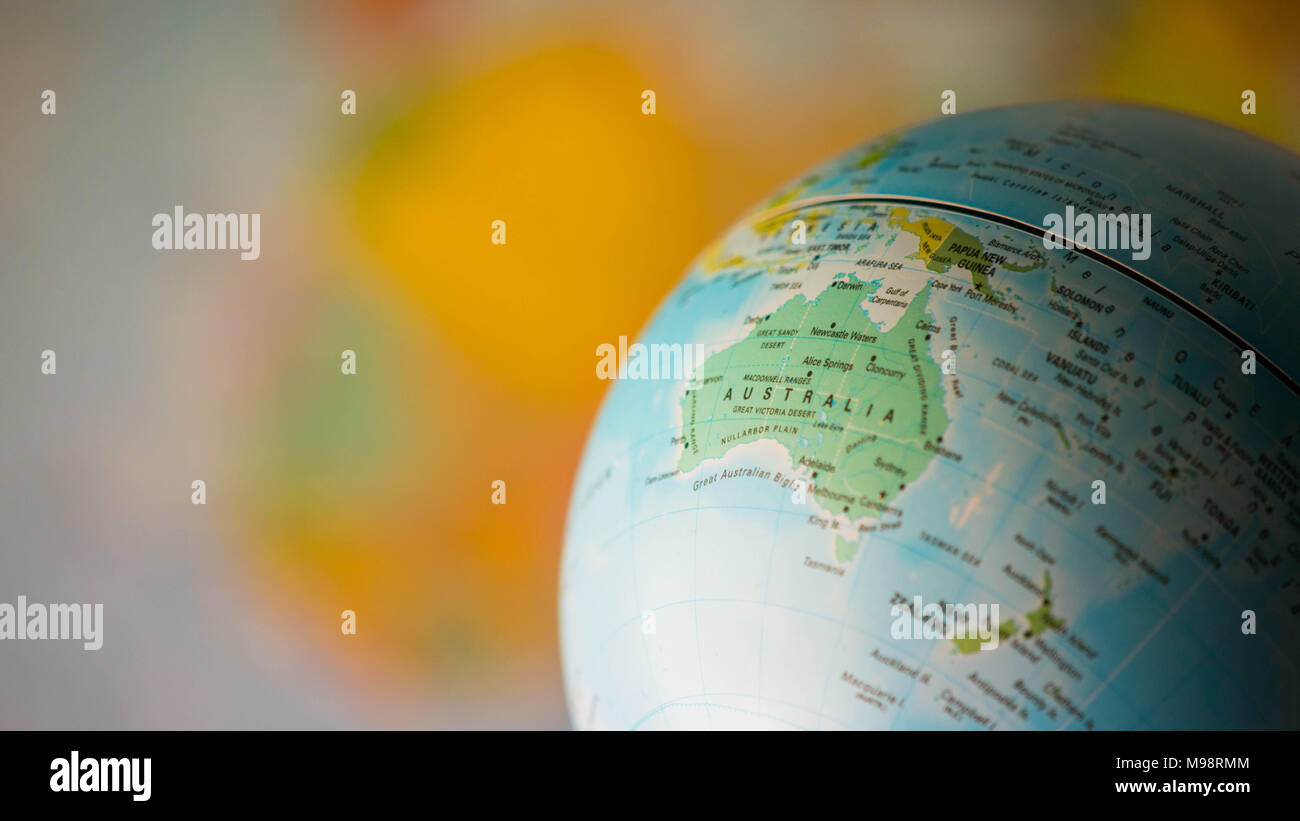 Australia map on a globe with earth map in the background Stock Photo ...