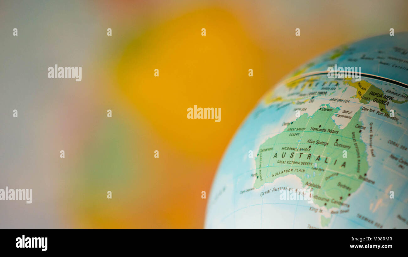 Australia map on a globe with earth map in the background Stock Photo ...