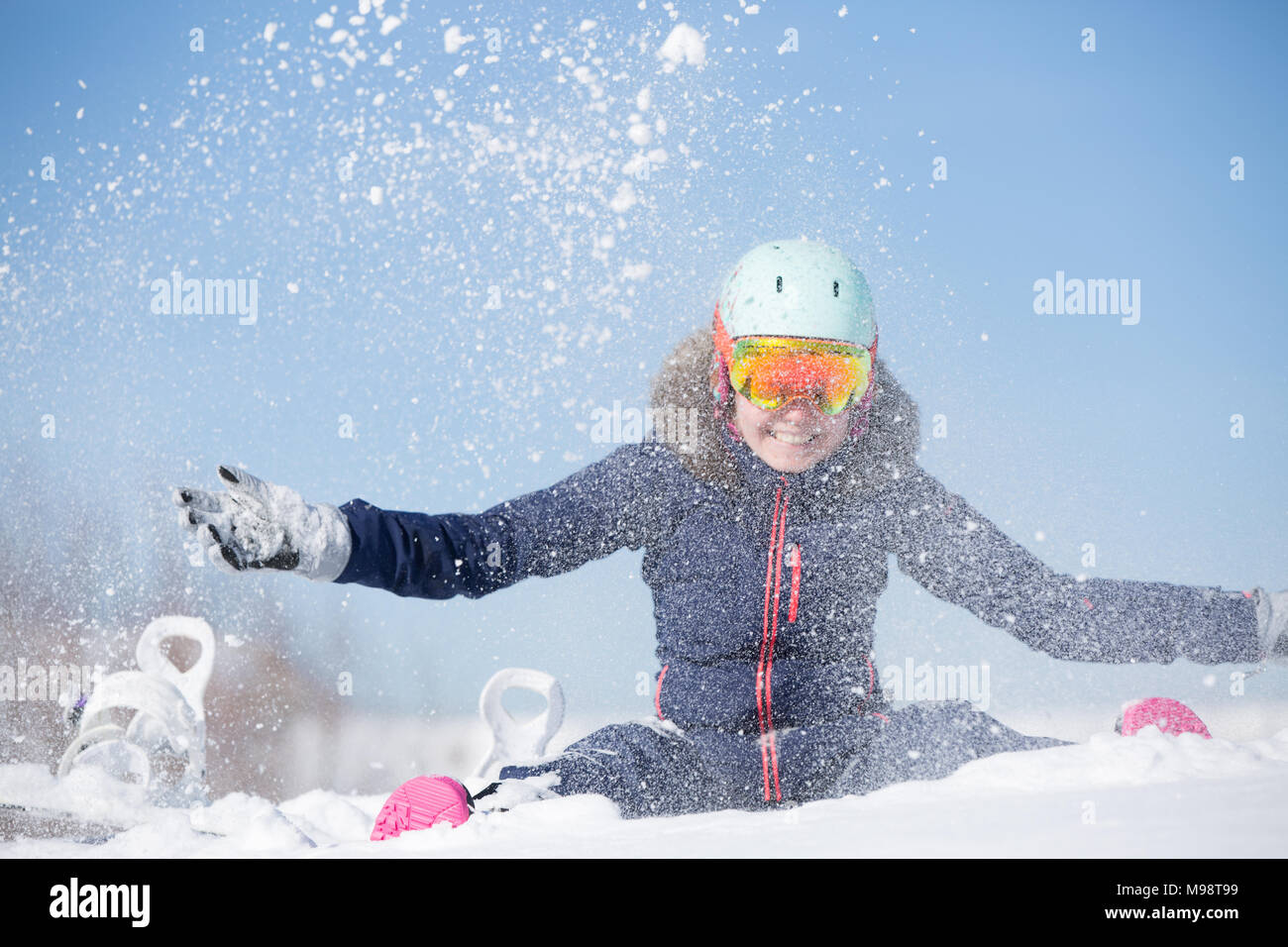 Girl throwing snow in park hi-res stock photography and images - Alamy