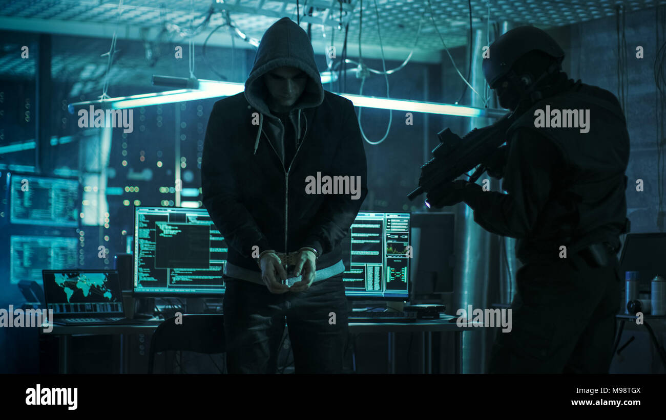 Handcuffed Hacker is Standing and Guarded by Fully Armed Special Forces ...
