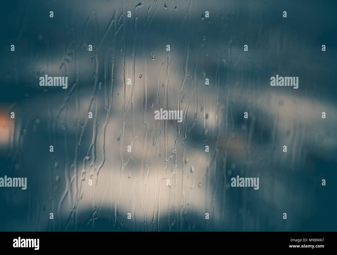 Abstract rainy window background, rain drops streaming down on glass ...
