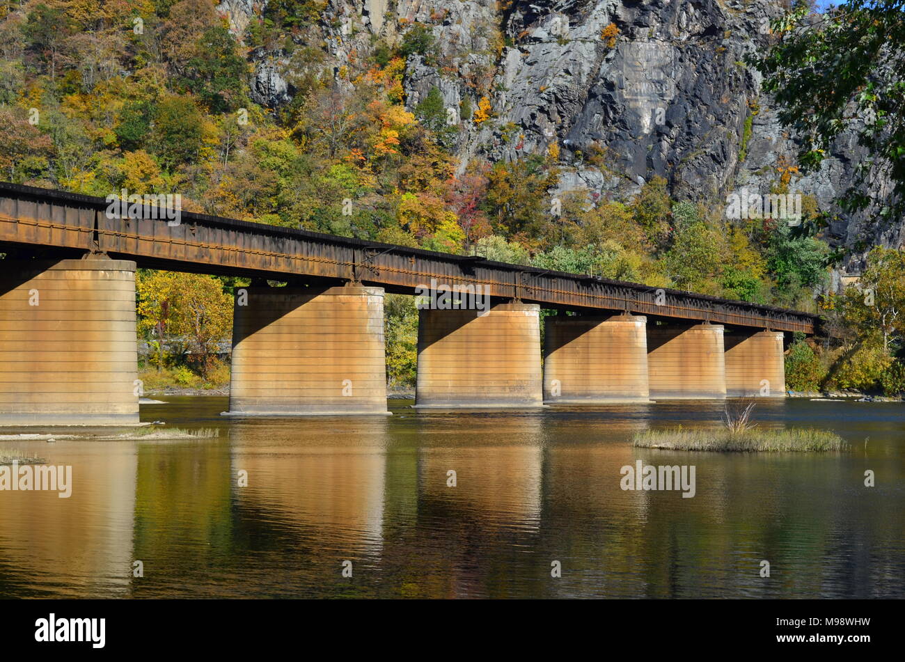 bridge with fall color trees and rocks Stock Photo - Alamy