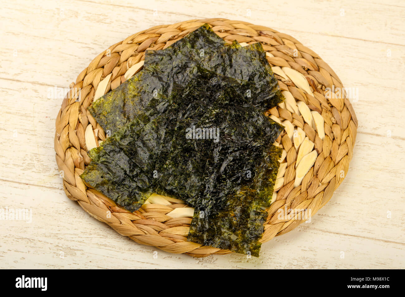 Crispy Nori sheets chips over wooden background Stock Photo - Alamy