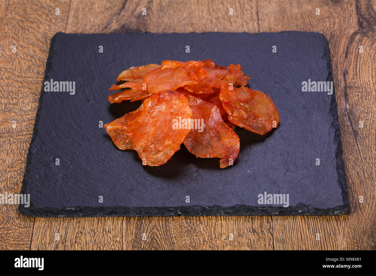Dry chicken meat over wooden Stock Photo - Alamy