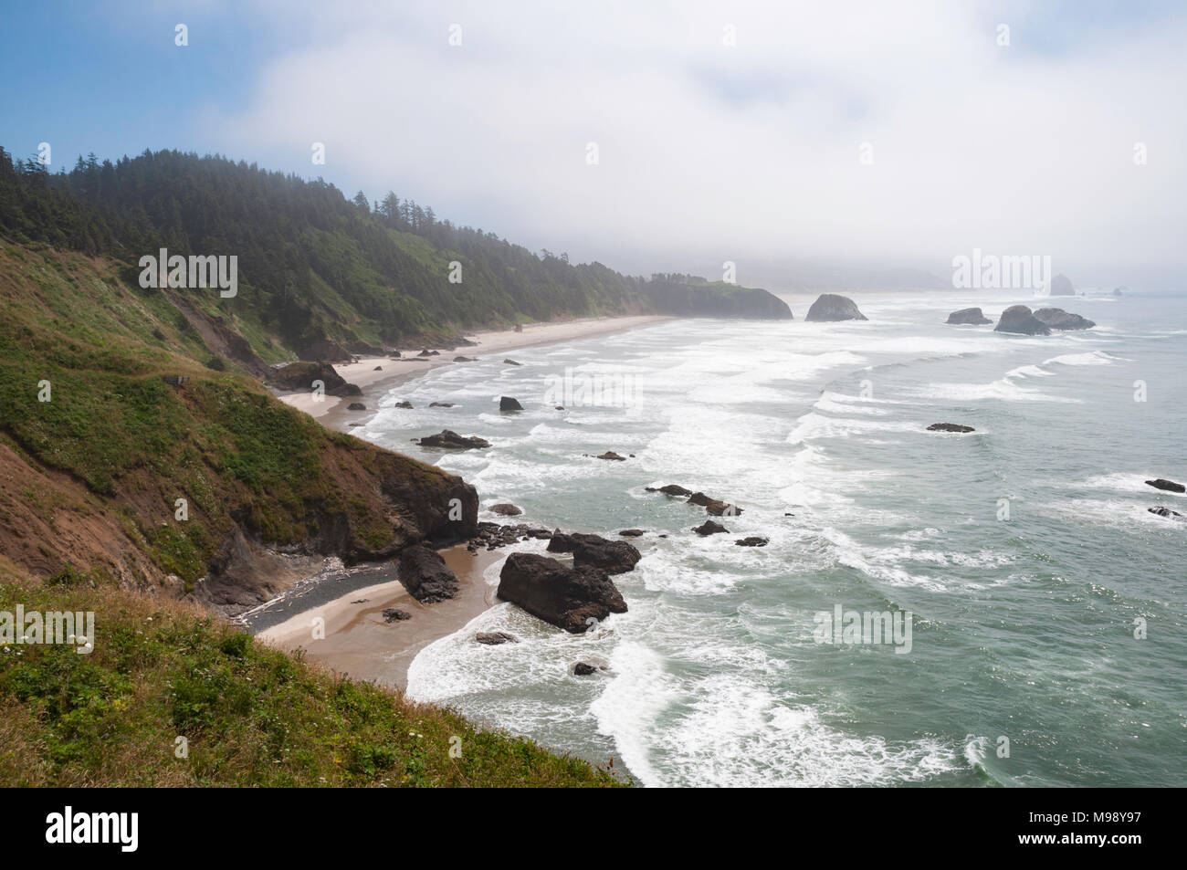 Oregon coast with fog rolling in Stock Photo - Alamy