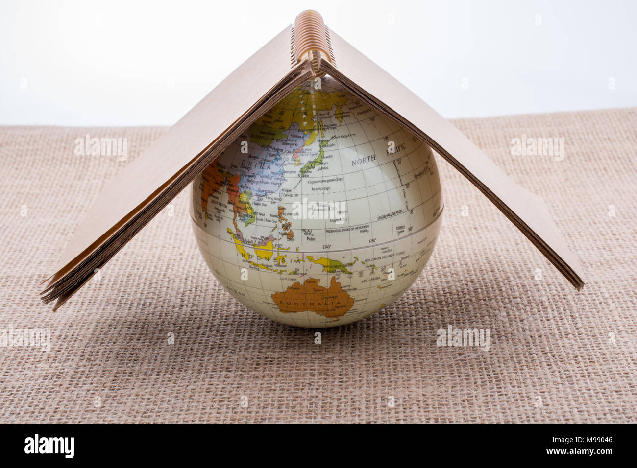 Globe is placed on canvas background Stock Photo - Alamy