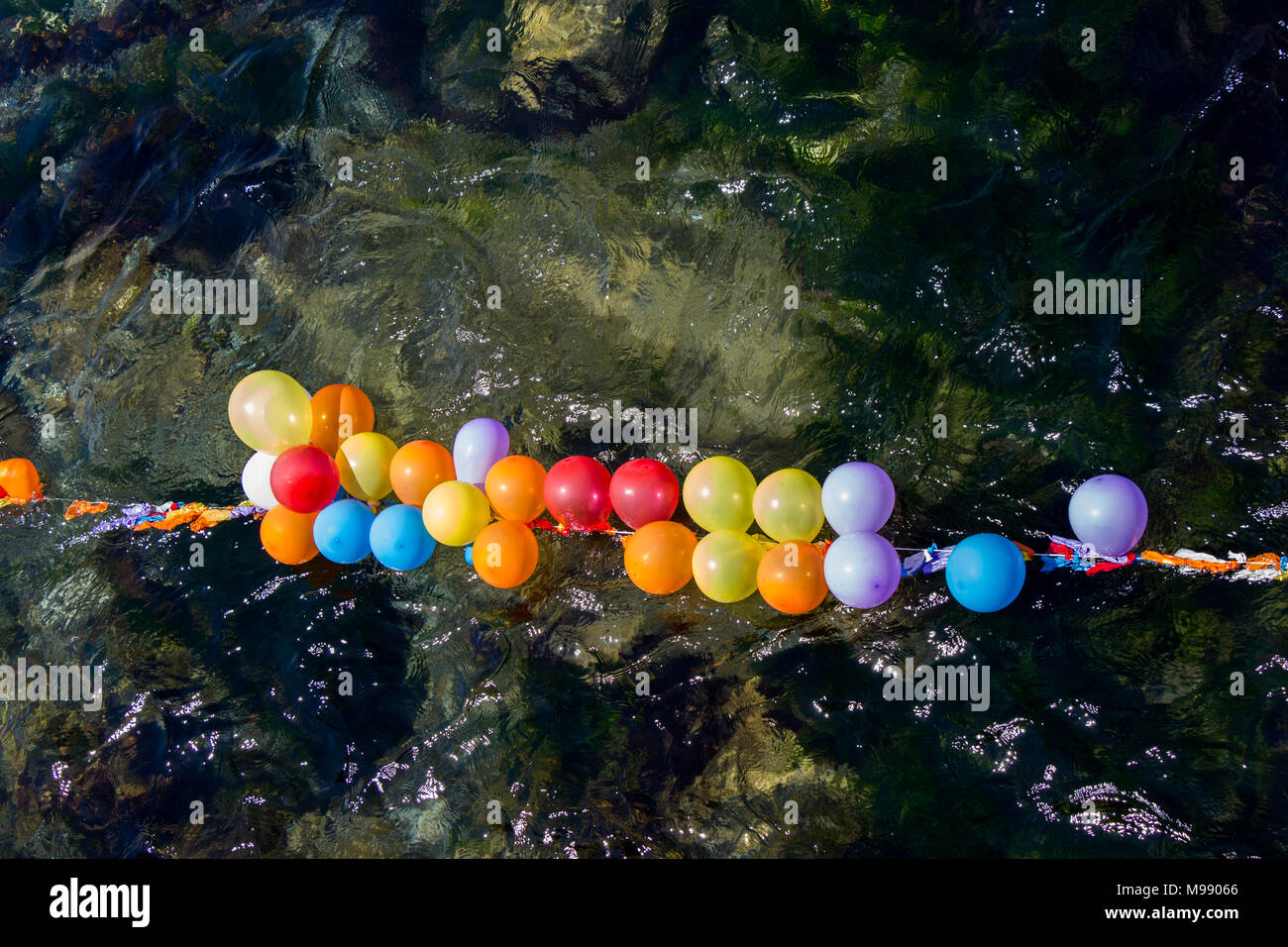 Balloons in shooting range as targets on water Stock Photo - Alamy