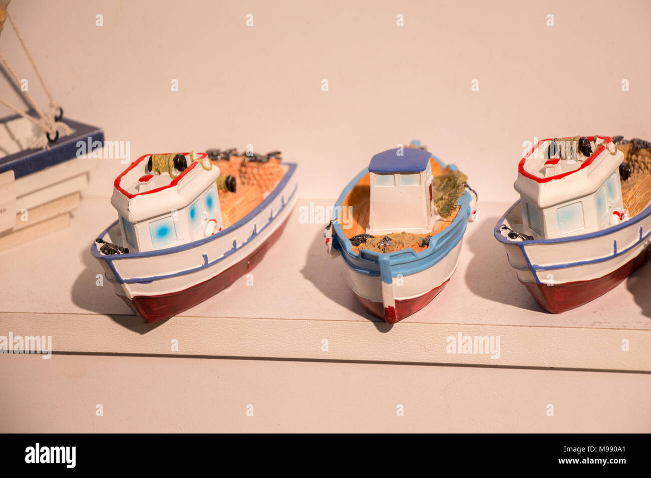 Set of small colorful wooden model boats Stock Photo - Alamy