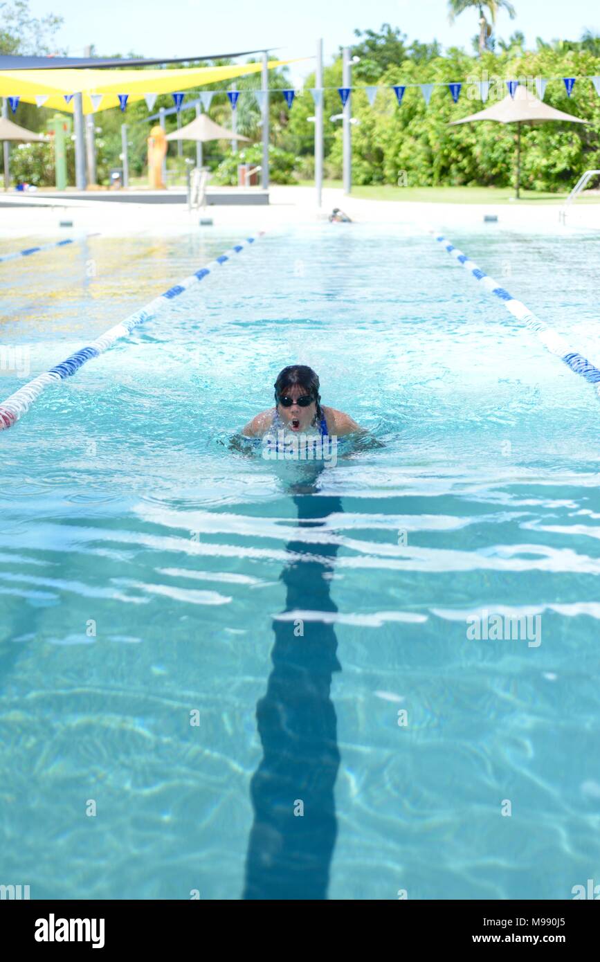 Woman swimming butterfly, Kokoda swimming pool, Townsville, Queensland ...
