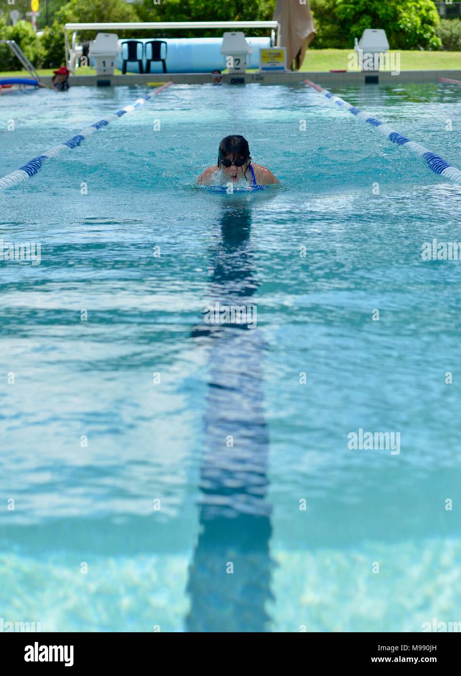 Woman swimming butterfly, Kokoda swimming pool, Townsville, Queensland ...