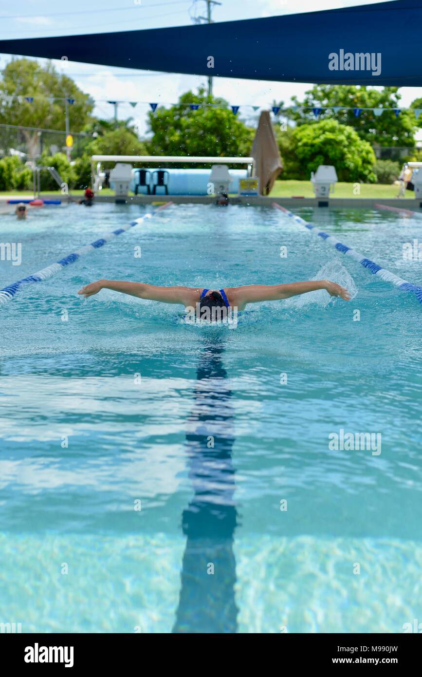 Woman swimming butterfly, Kokoda swimming pool, Townsville, Queensland ...