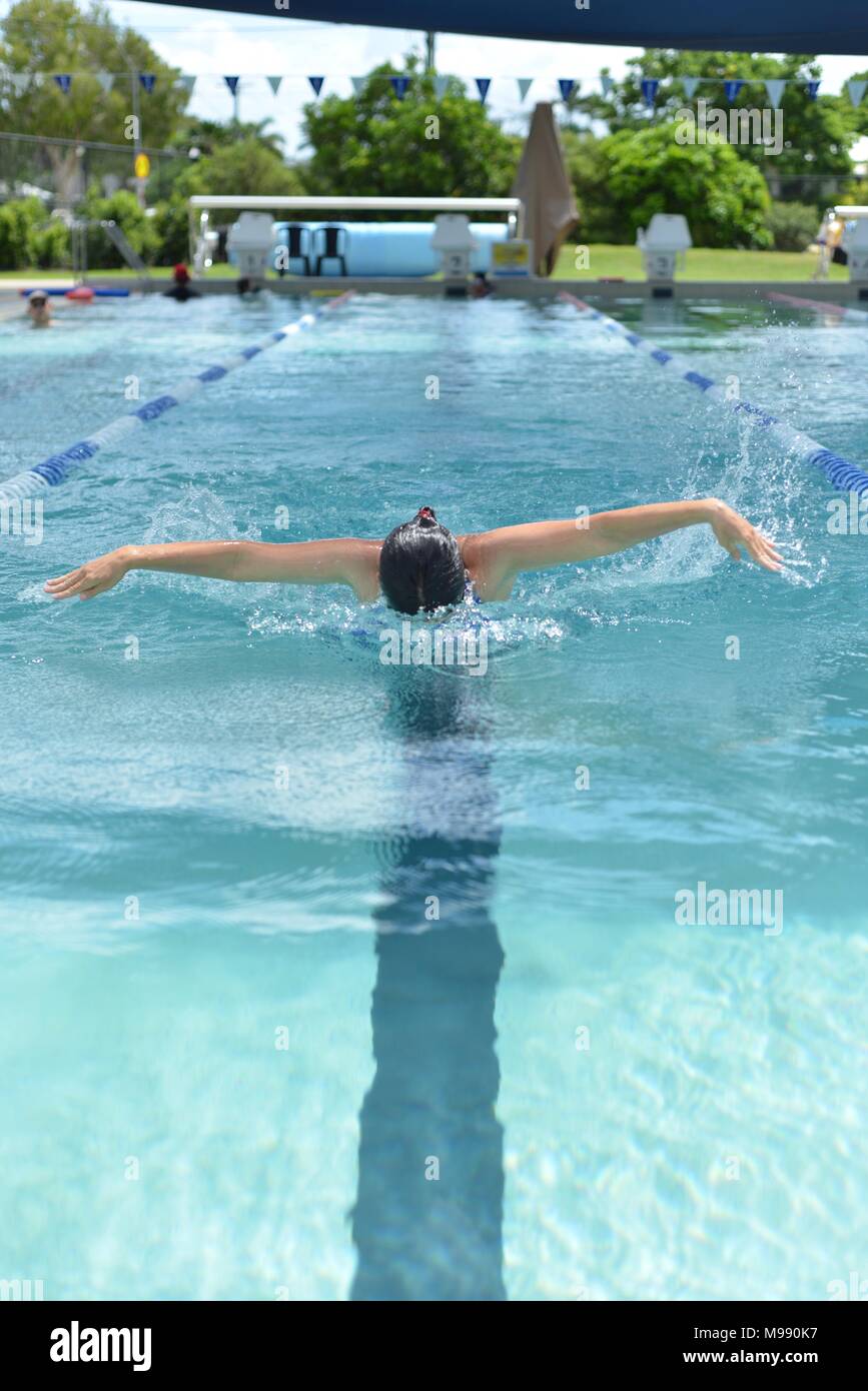 Woman swimming butterfly, Kokoda swimming pool, Townsville, Queensland ...