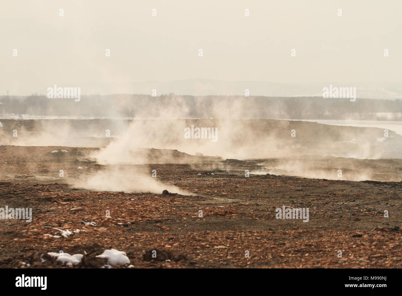slag dump, smoke on slag dump, pollution Stock Photo - Alamy