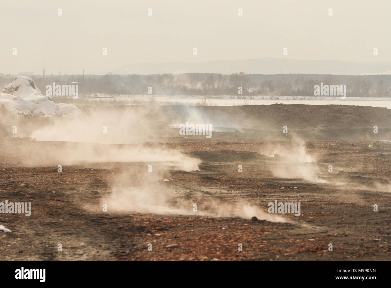 slag dump, smoke on slag dump, pollution Stock Photo - Alamy