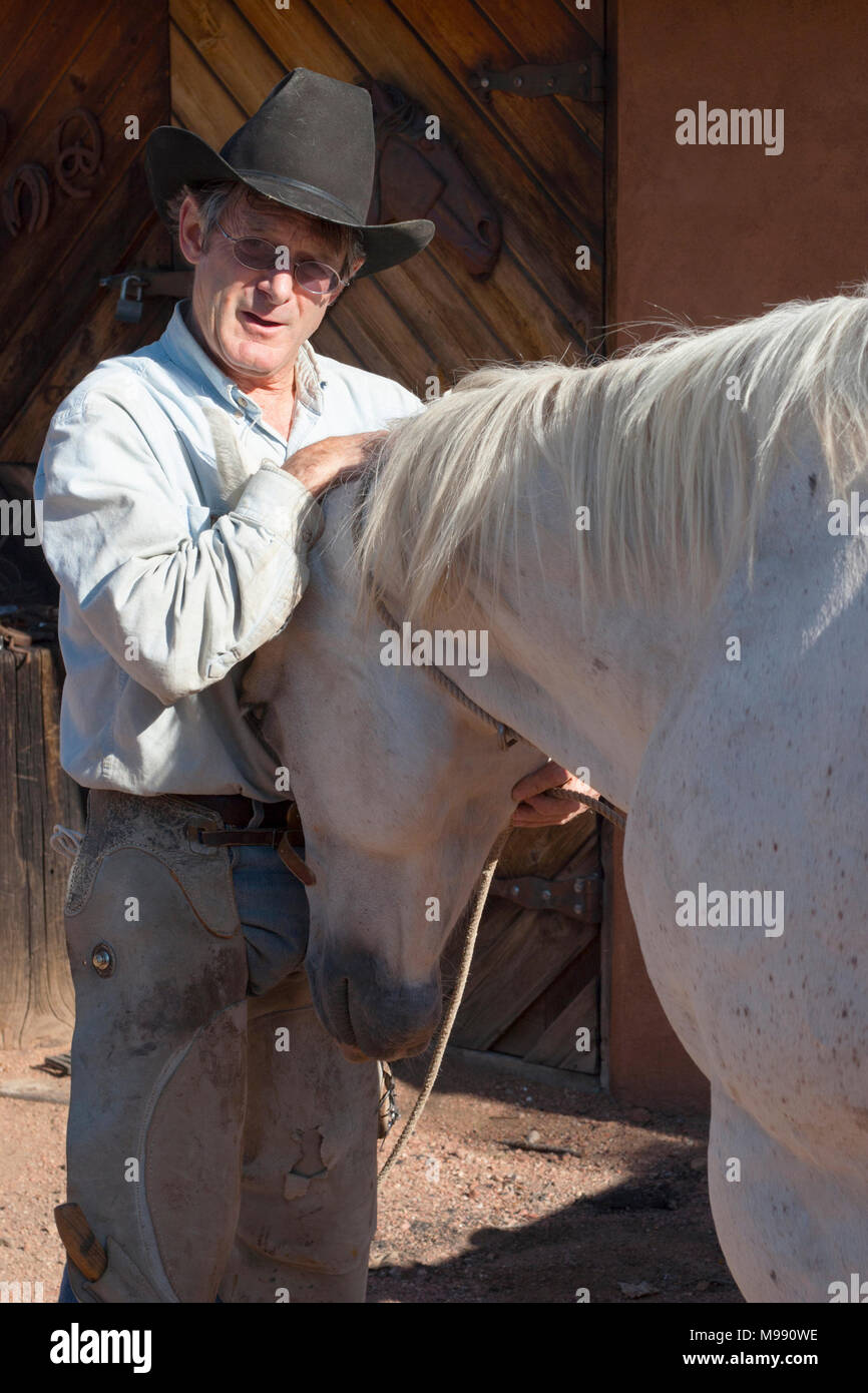 Cowboy having a quiet and affectionate moment with his horse in ...