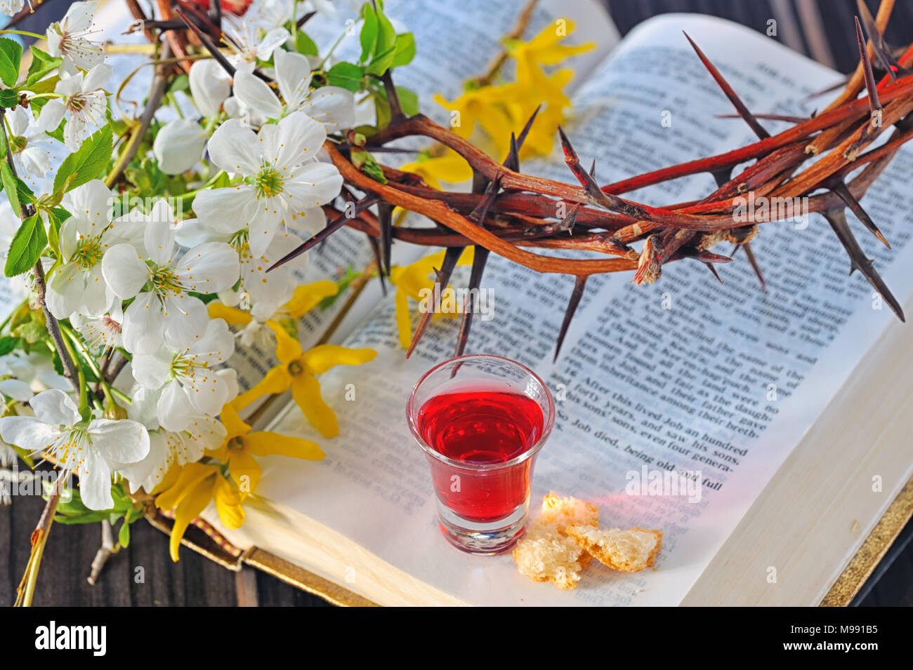 Communion cup with wine and bread on bible Stock Photo - Alamy