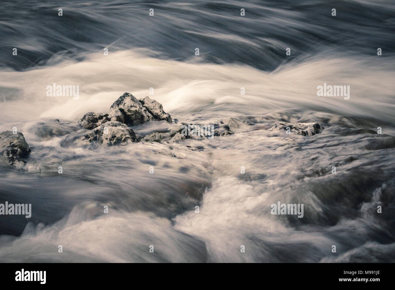 A powerful stream of mountain river. The fast current of water Stock ...