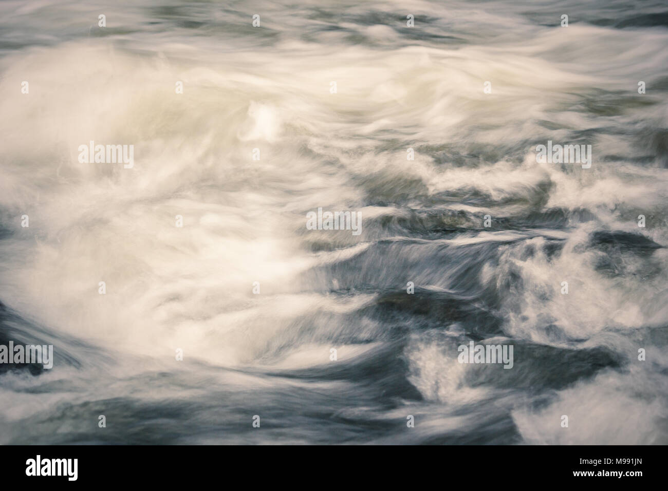 A powerful stream of mountain river. The fast current of water Stock ...
